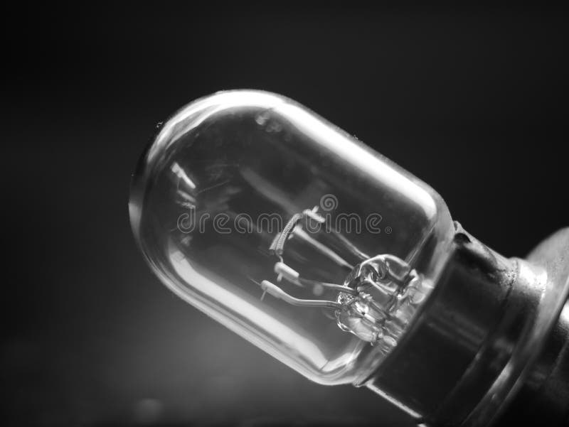 Weak Yellow Bulb Light on Black Background Stock Photo - Image of ...