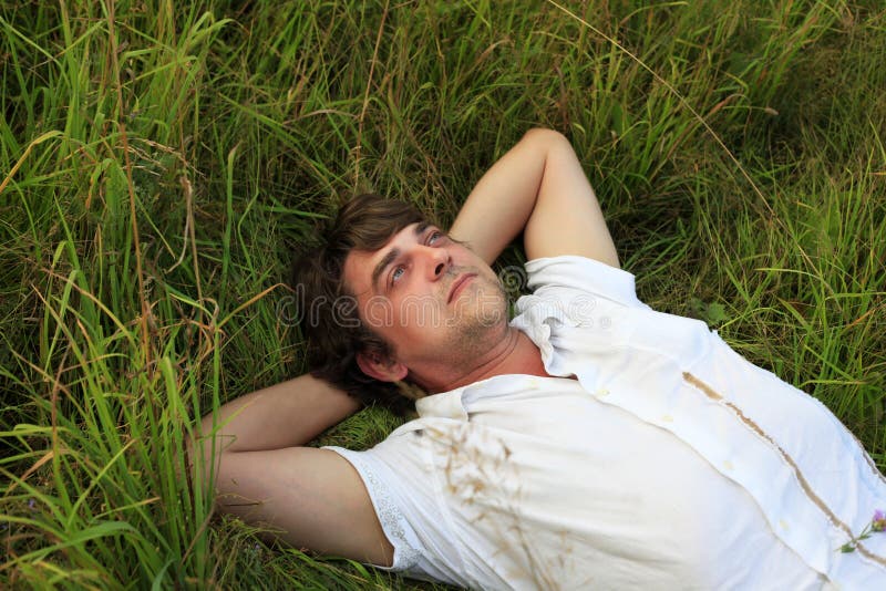 Weakening in a grass stock photo. Image of carefree, spread - 15668098