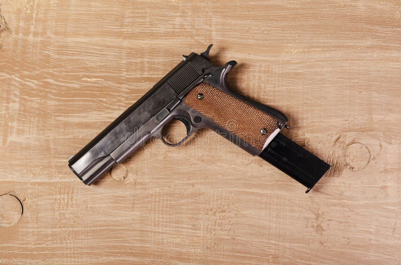 Weapon. Pistol on Wooden Background. Firearms for Protection and Stock ...