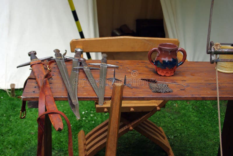 Medieval Weapons On A Wooden Table Stock Photo - Image of equipment ...