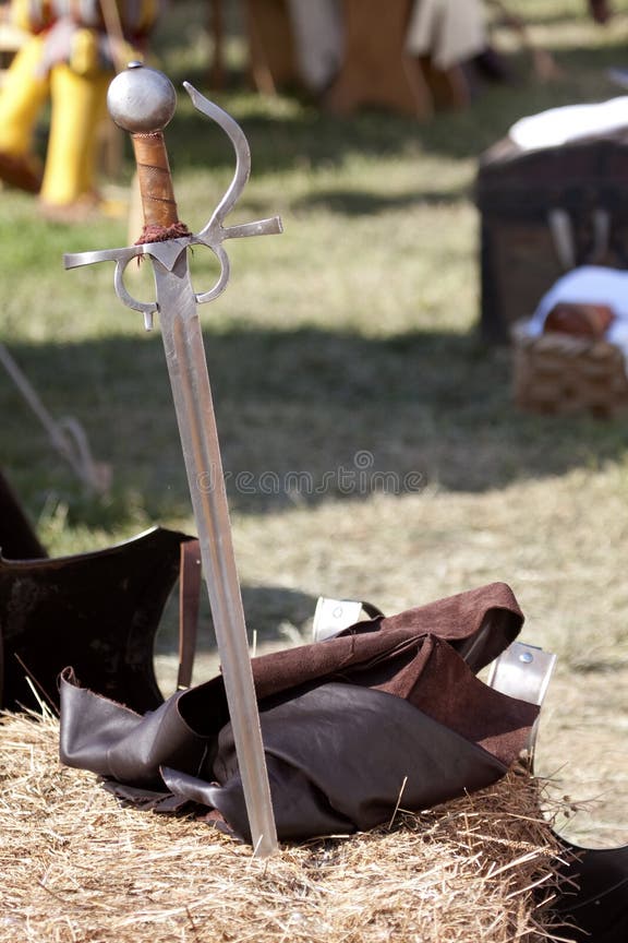 Weapons and Armors: the Sword in the Straw. Stock Image - Image of ...
