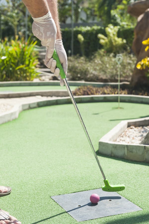 Mini Golf Balls and Club stock image. Image of yellow - 45069677