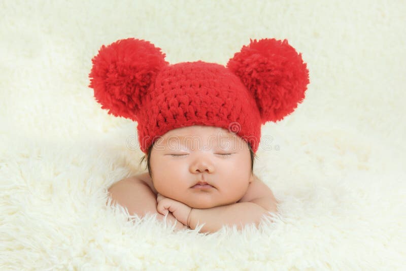 Wearing a Red Hat and Sleeping with a Baby Stock Photo - Image of ...