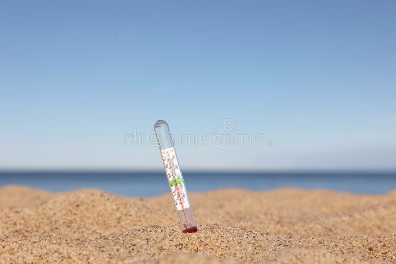 Weather Thermometer in Sand Near Sea, Space for Text Stock Photo ...