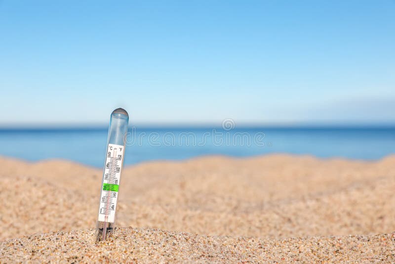 Weather Thermometer in Sand Near Sea, Space for Text Stock Photo ...