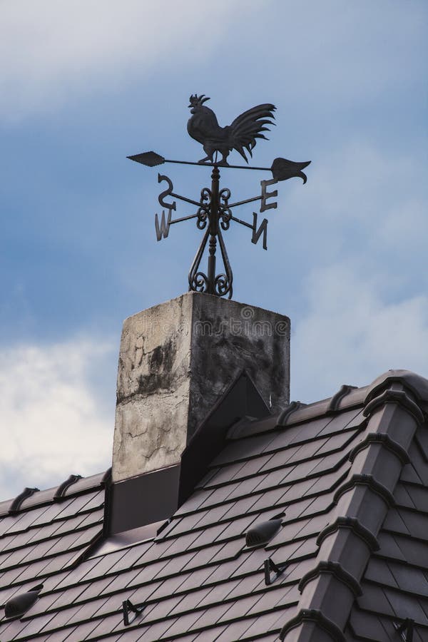 Weather vane on the roof stock image. Image of house - 84187375