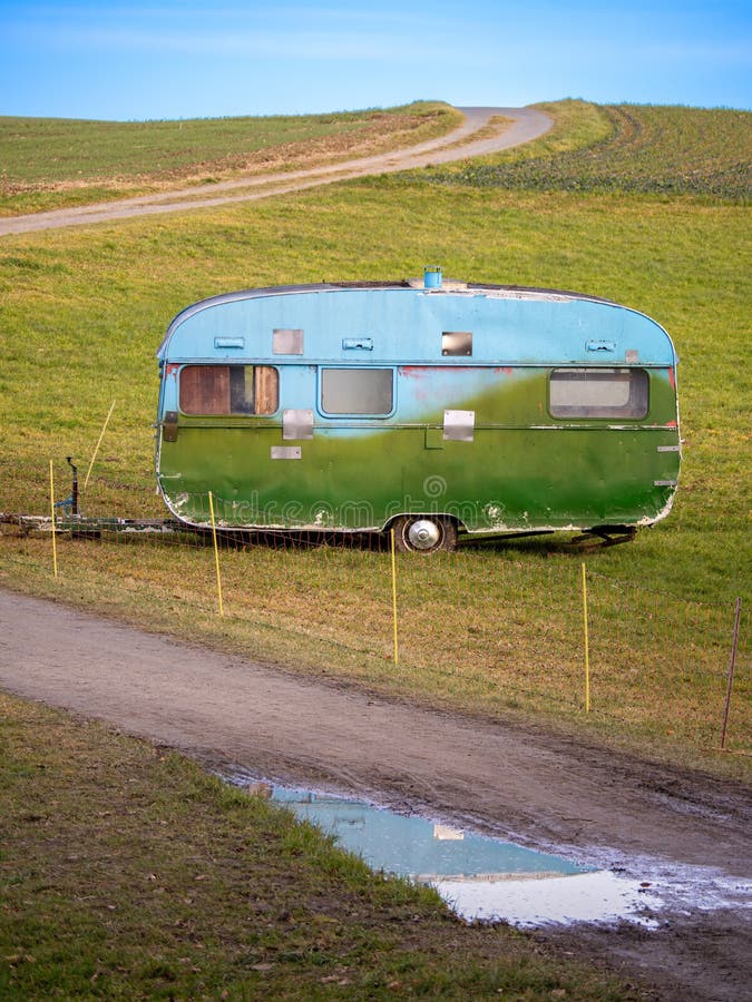 Weathered Caravan in a Grassy Field Editorial Photography - Image of ...