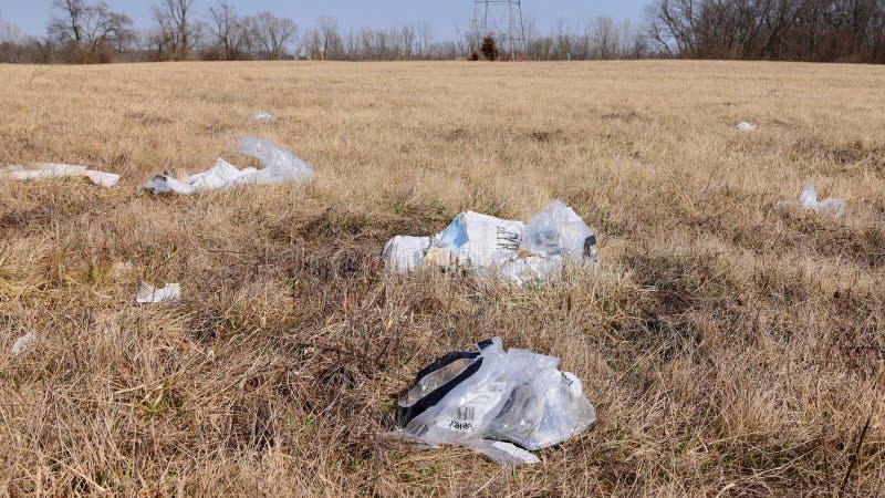 Trash dumped in a field editorial stock image. Image of residue - 310132349