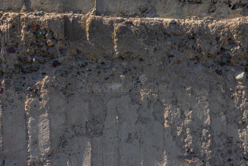 Weathered Cheap Uneven Concrete Surface with Pebbles Under Tangential ...