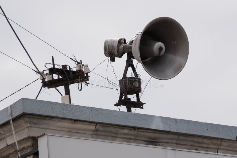 Civil Defense Siren on Rooftop: Vintage Alarm System, Metal Pole, Grey ...