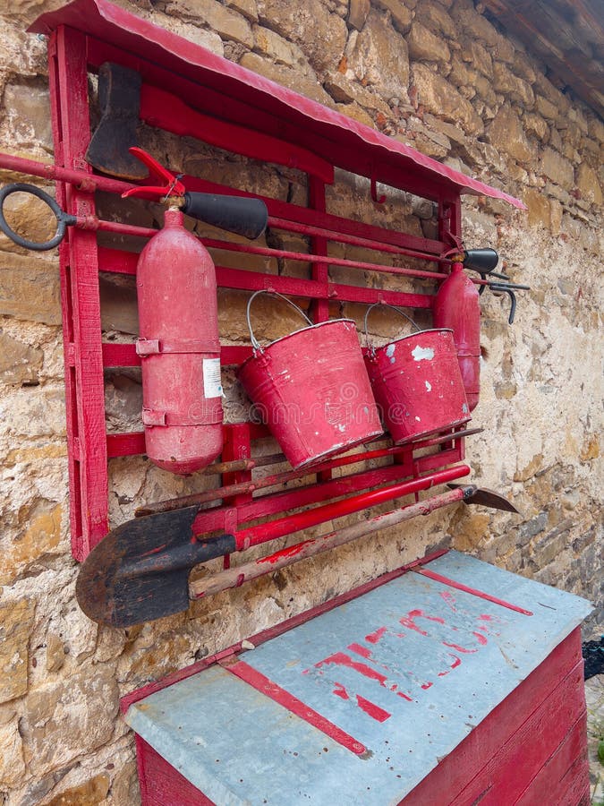 Weathered Fire-fighting Equipment on a Wall Outside Stock Image - Image ...