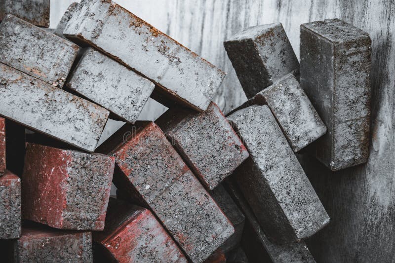 Weathered Gray and Red Bricks Stacked and Tumbled Over Abstract Grunge ...