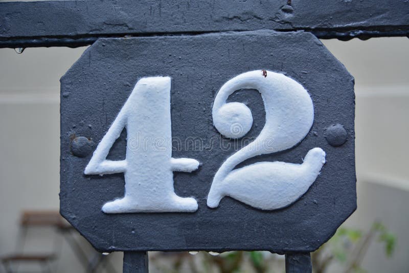 A Weathered Light Blue House Number Plaque, Showing the Number Forty ...