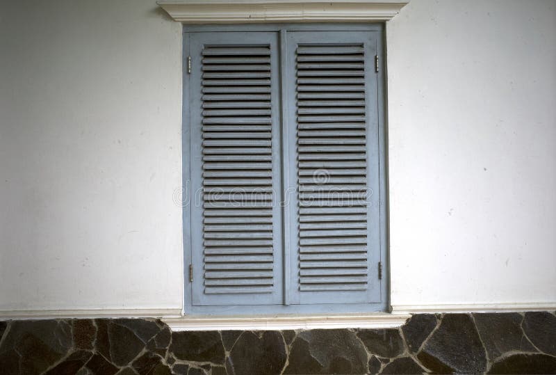 A Weathered Light Blue Old Vintage Window on White Wall Stock Image ...