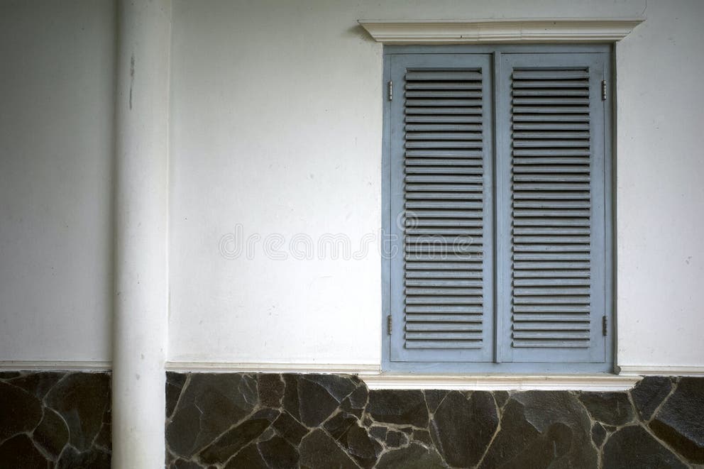 A Weathered Light Blue Old Vintage Window on White Wall Stock Photo ...