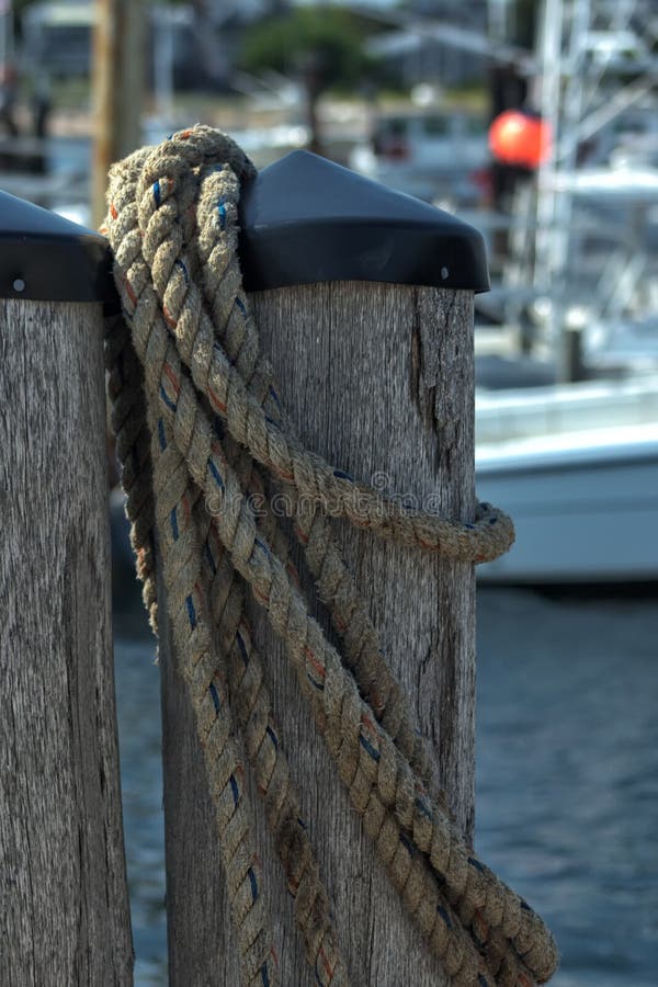 Weathered Manila Hemp Rope Coiled on a Pier Pylon Stock Photo - Image ...