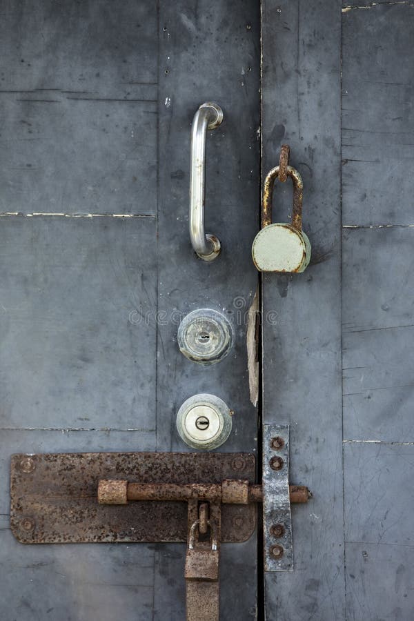 Weathered Metal Security Door Covered in Locks on the Island of Cozumel ...