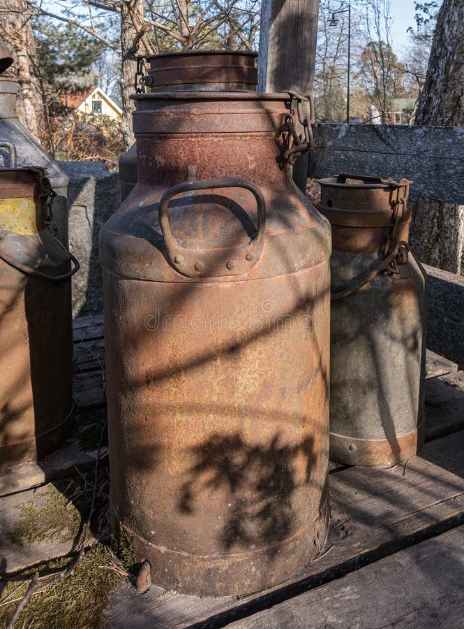A Weathered Rusty Milk Can Exudes Rustic Charm Stock Photo - Image of ...