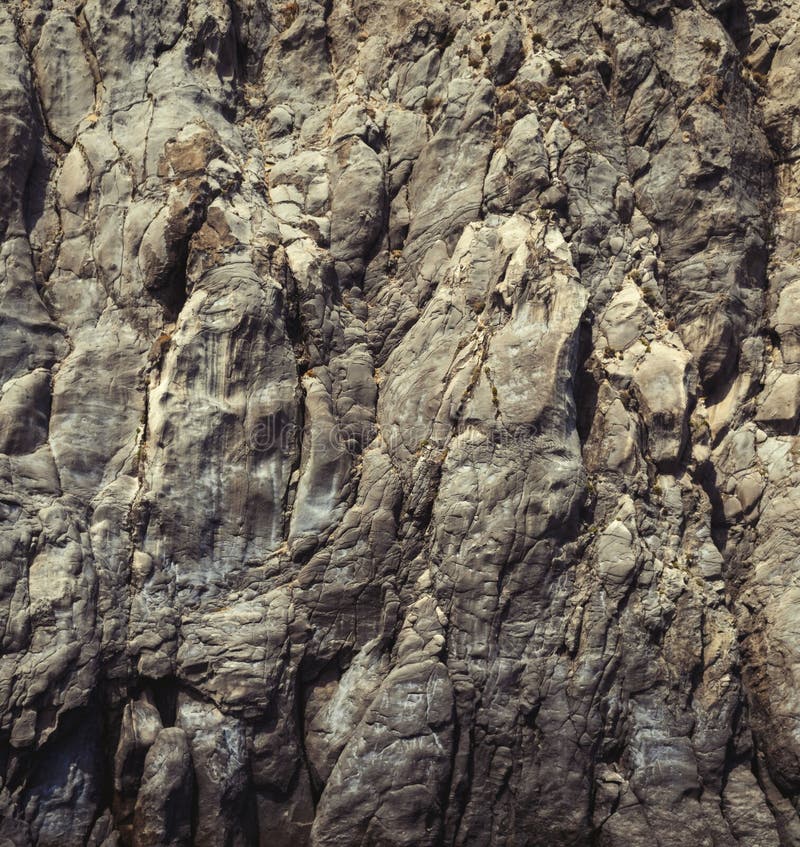 Weathered Seaside Rock Face Texture. Aged Volcanic Stone Wall Surface ...