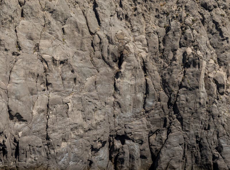 Weathered Seaside Rock Face Texture. Aged Volcanic Stone Wall Surface ...