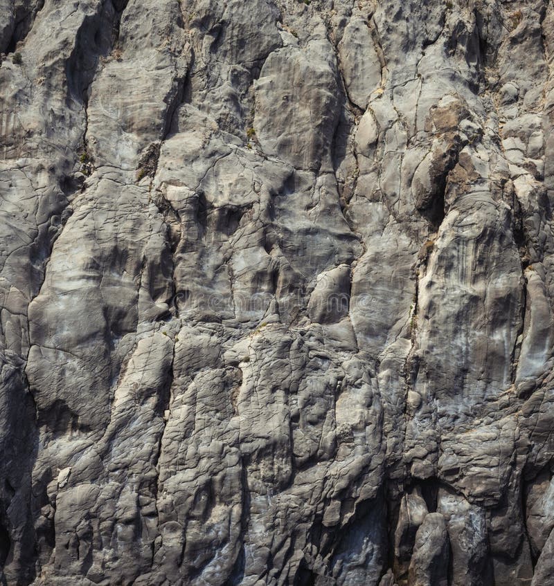 Weathered Seaside Rock Face Texture. Aged Volcanic Stone Wall Surface ...