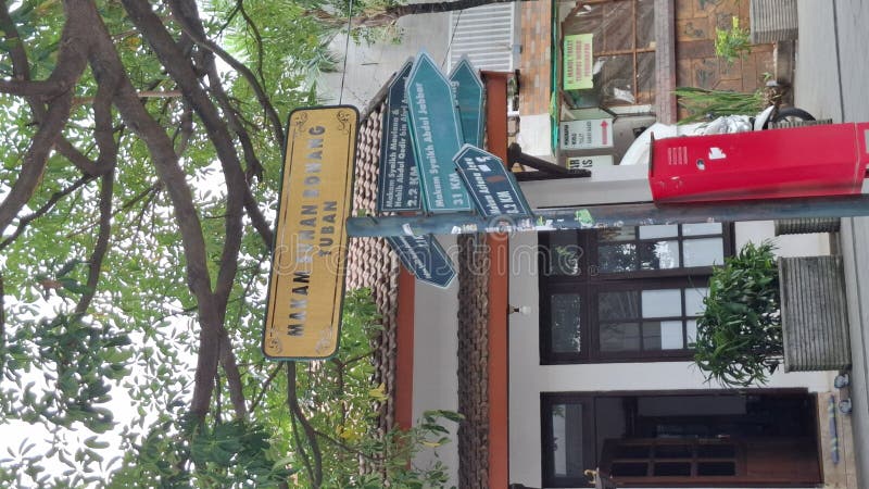 A Weathered Signpost with Multiple Directional Signs Indicating Various ...