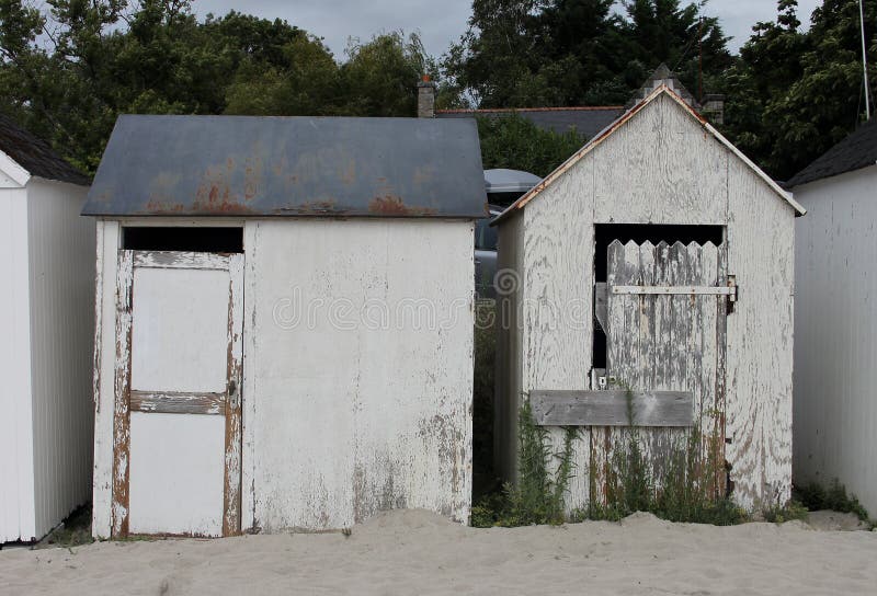 Weathered white beach huts stock image. Image of outdoors - 59232721