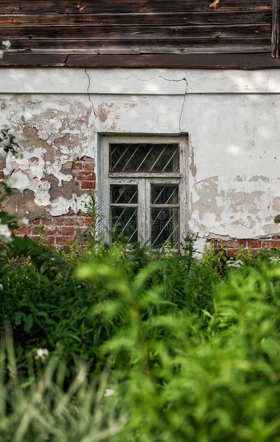 Weathered Window with Peeling Paint on a Rustic Brick Wall Surrounded ...