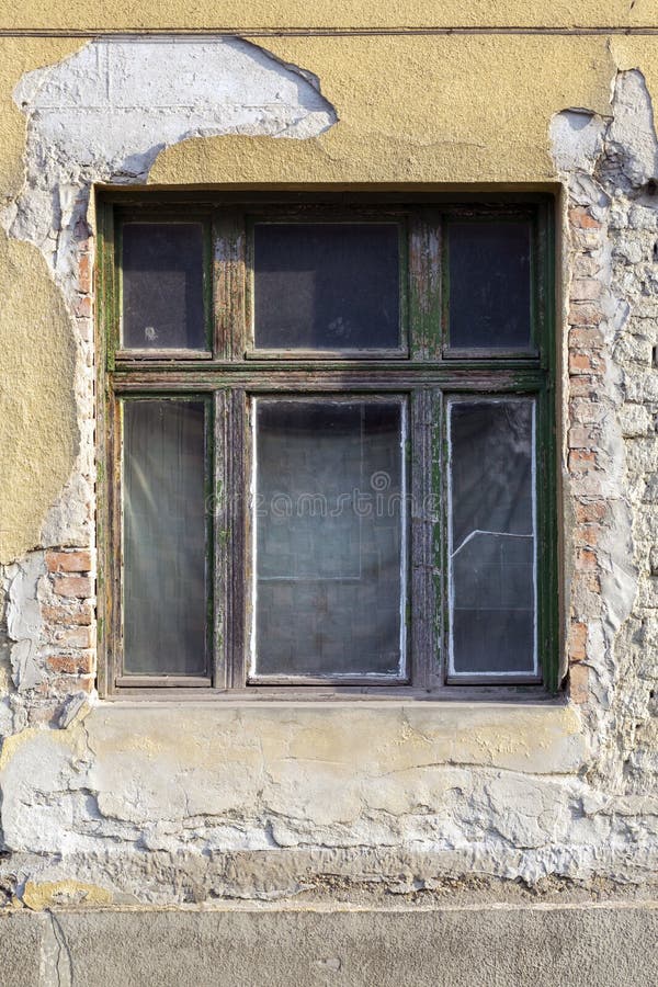 Weathered Window on a Rustic Building Showcasing Peeling Paint and Aged ...