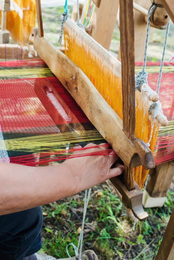 Weaving on a wooden loom stock photo. Image of decor - 73608782