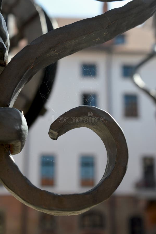 A web on a curl of iron. stock photo. Image of outdoor - 282967176