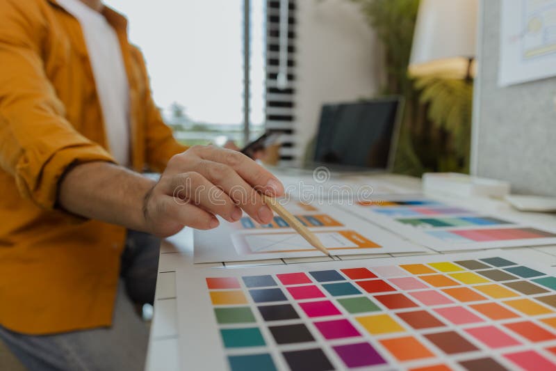 A Web Developer, As a User Experience and User Interface Officer, is Designing Beautiful and ...