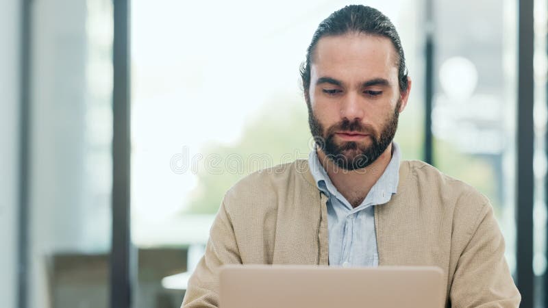 Web Developer Working on a Laptop Inside a Modern Office. a Young ...