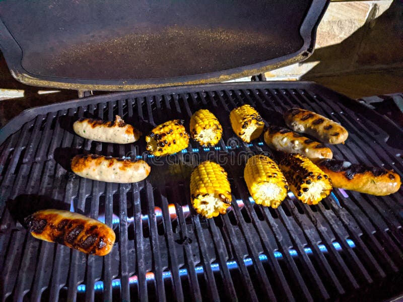 Weber BBQ Cooking Snags and Corn on the Cob Stock Image - Image of ...