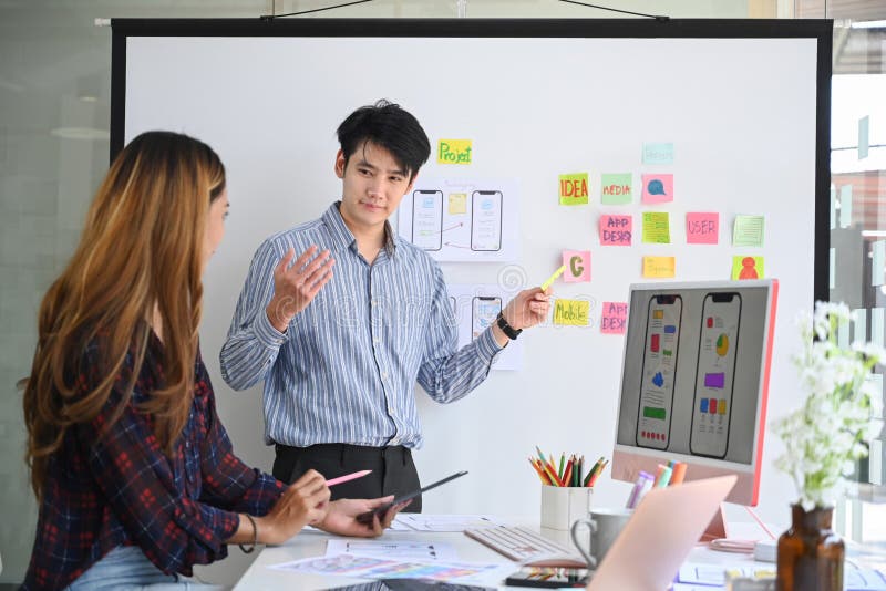 Website Development Team Reviewing Interface Wireframe Design for ...