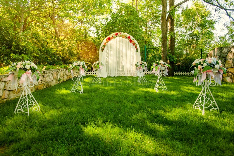 Wedding Arch on the grass stock photo. Image of plant - 25245762