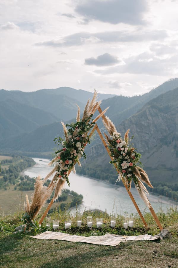 Wedding Arch in the Shape of a Triangle with Flowers Stock Photo ...