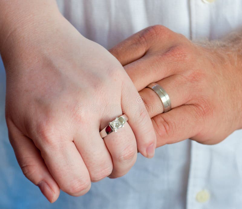 Hands with wedding rings stock image. Image of holding - 30163377