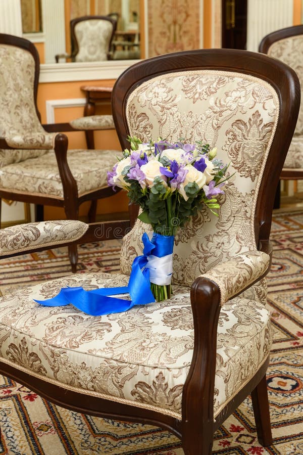 Wedding Bouquet with Blue Ribbon on a Chair Stock Photo - Image of ...