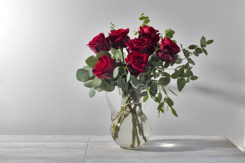 A Wedding Bouquet of Nine Roses and Various Varieties of Eucalyptus in ...