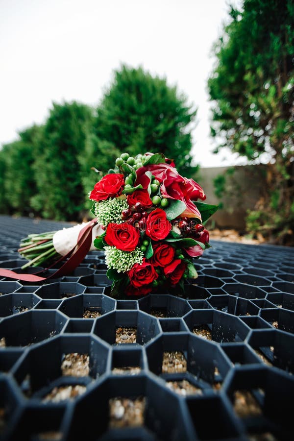 Wedding Bouquet of Red Roses on the Floor. Stock Photo - Image of leaf ...