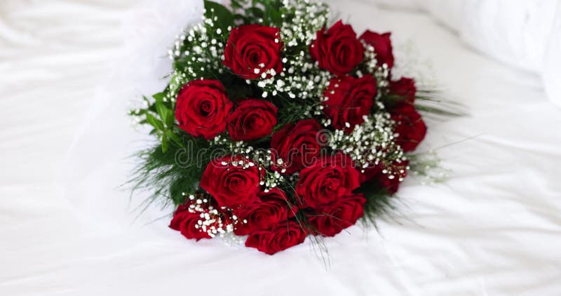 Wedding Bouquet of Red Roses Lying on Bed with Blanket Stock Footage ...