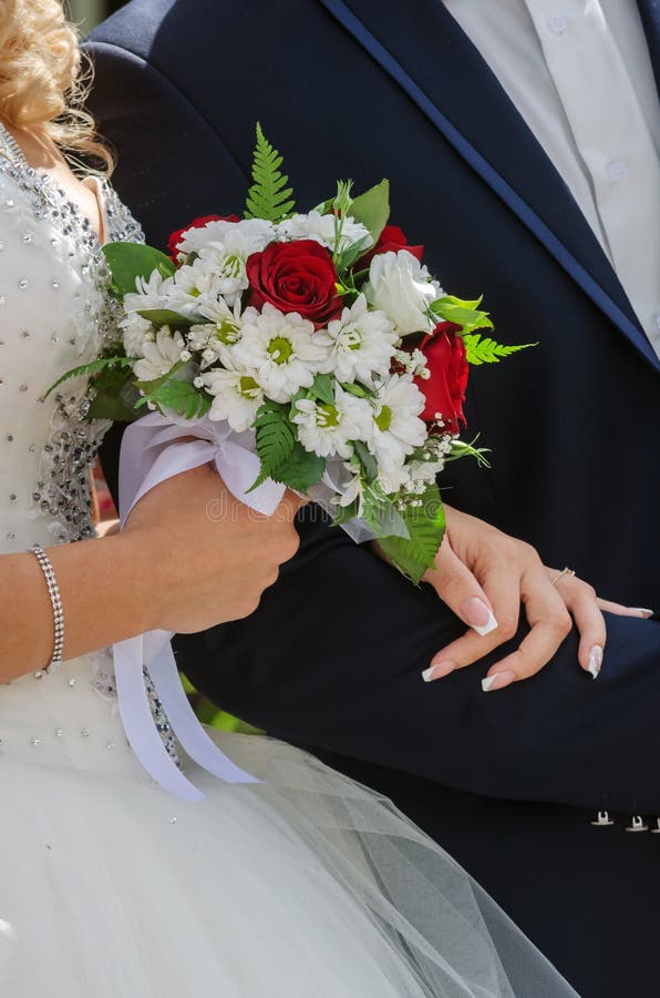 Wedding bouquet with roses stock photo. Image of hands - 74063104