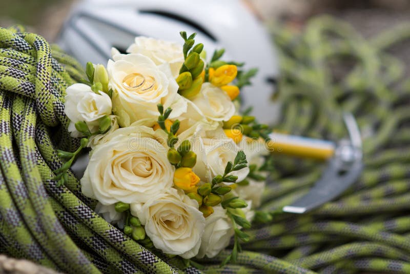 A Wedding Bouquet of White Roses with Gold Hoops with Rope Stock Image ...