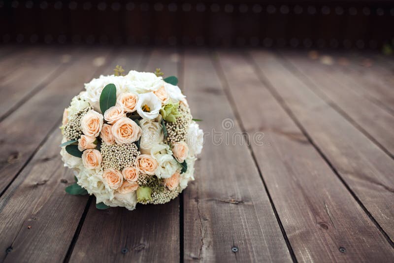 Wedding Bouquet of White Roses on a Wooden Background Stock Image ...