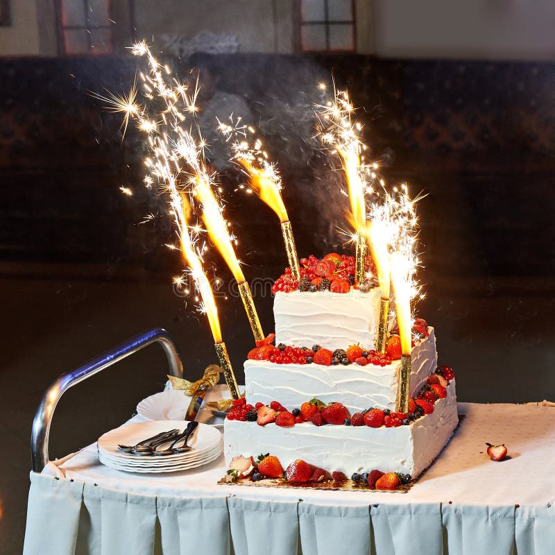 Wedding Cake with Berries and Fireworks Stock Photo - Image of plates ...