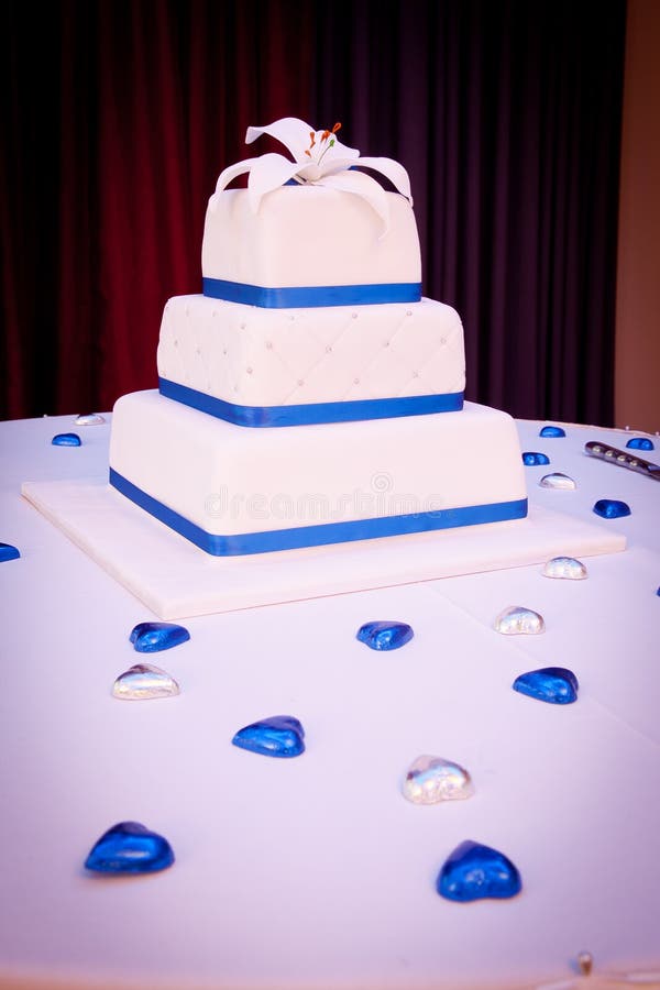 Wedding Cake with Blue Ribbons and Chocolates Stock Image - Image of ...