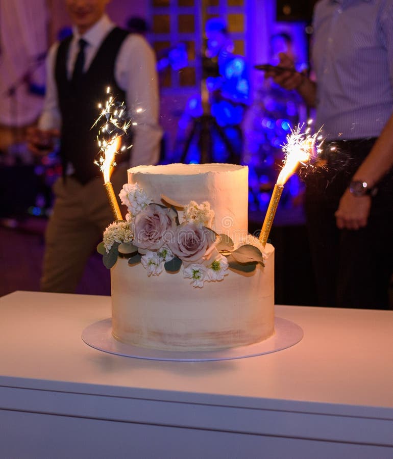 Celebration Cake with Fireworks at a Wedding Reception Stock Image ...