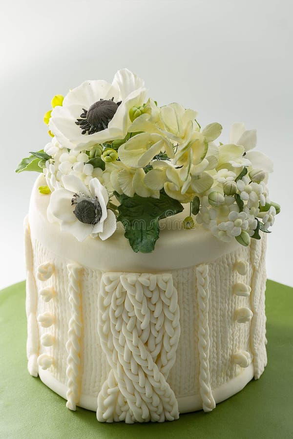 Wedding Cake with Knitted Pattern and Edible Flowers Stock Photo ...