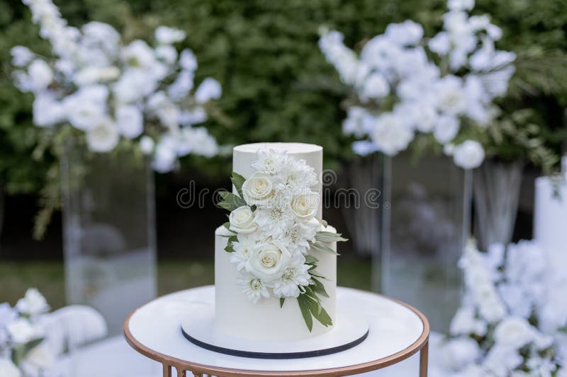 Wedding Cake Near Arch for the Evening Ceremony Stock Photo - Image of ...